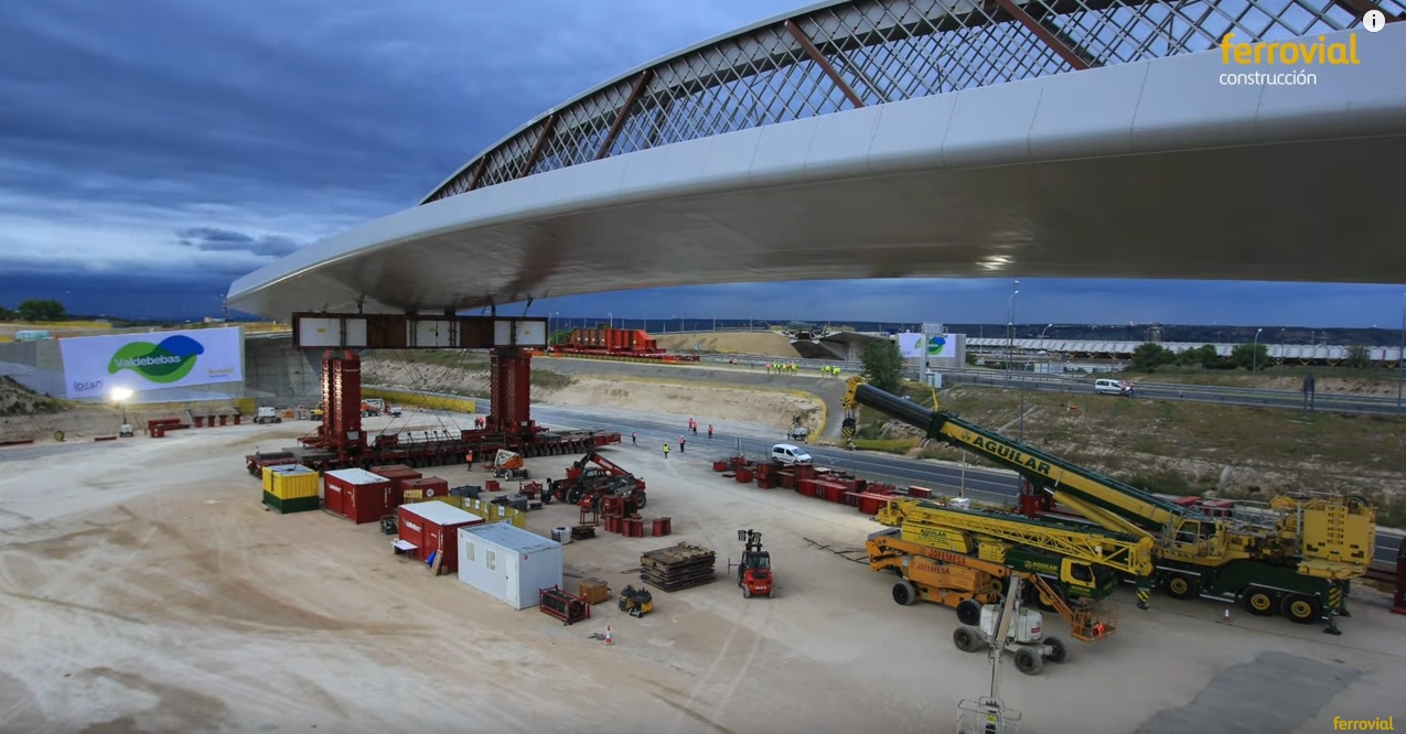 See Ferrovial roll 2,400-ton bridge into place over Madrid motorway ...